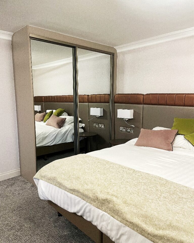 A Hotel installation Sliding Mirrored Robe and Desk - Slide Glide